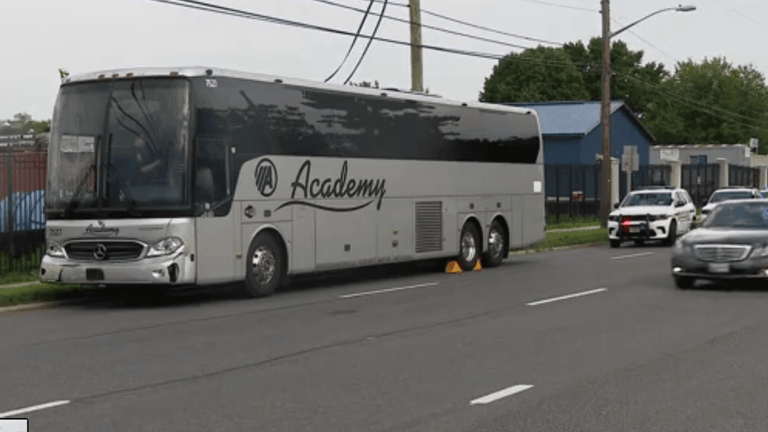 Loaded charter bus crashes after suspected brake problem damaging poles ...