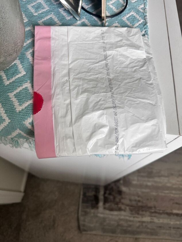 Wardrobe on the go: The trash bag hanger hack