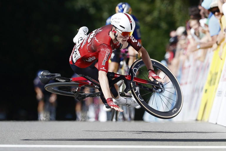 Belgian rider crashes over finish line and still wins