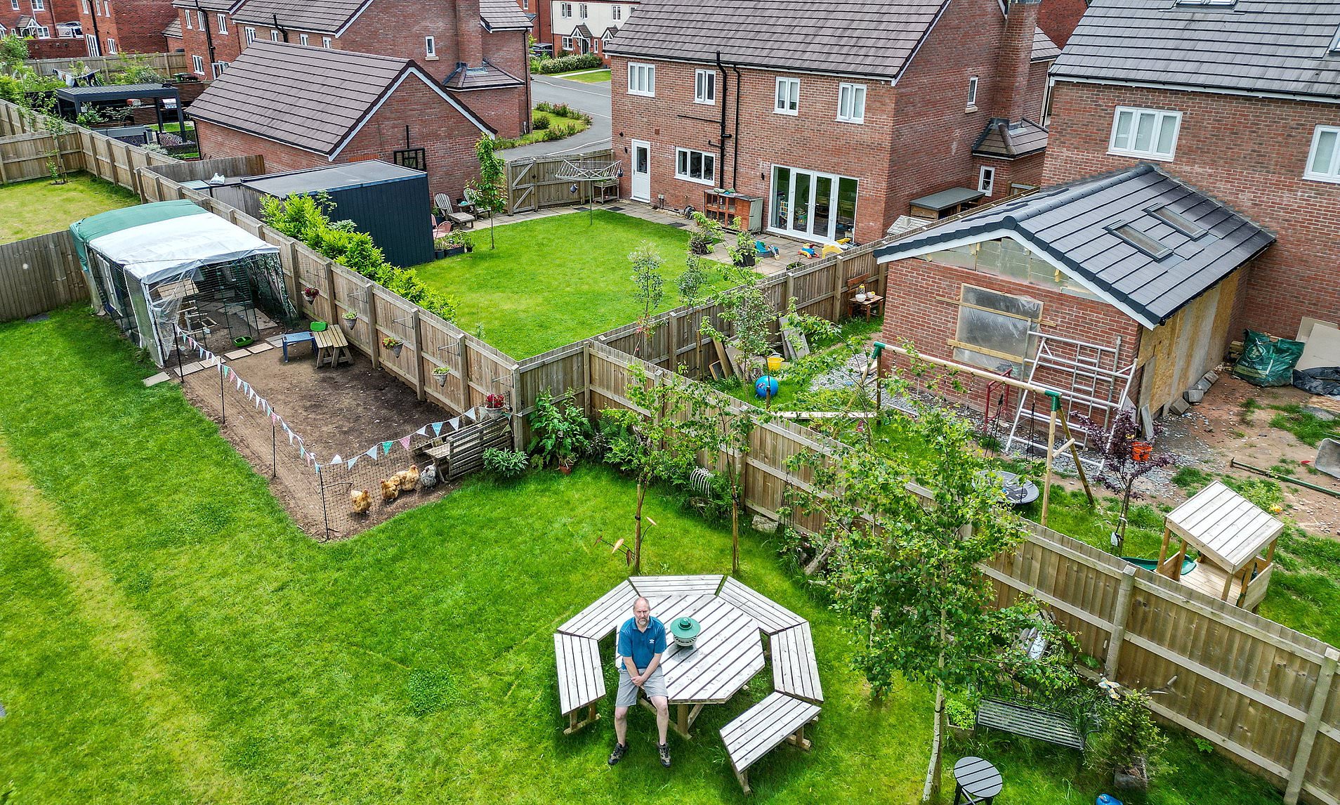 Father embroiled in land row with neighbours who built garden office ...
