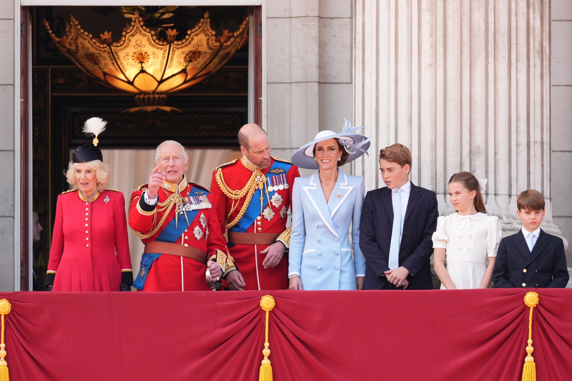 Kate glares at anti-monarchy protesters booing her and the children