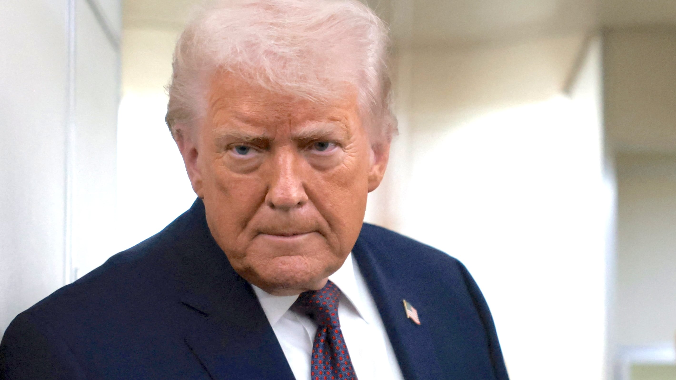 Trump posts through night on flight to G7 summit