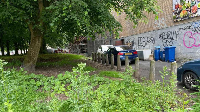 Two men charged after woman attacked in Glasgow lane