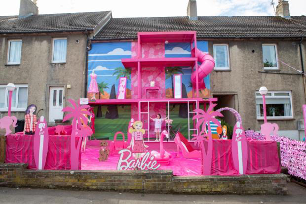 Mum spends £5k transforming home into 'Barbie Dreamhouse' with pink slide