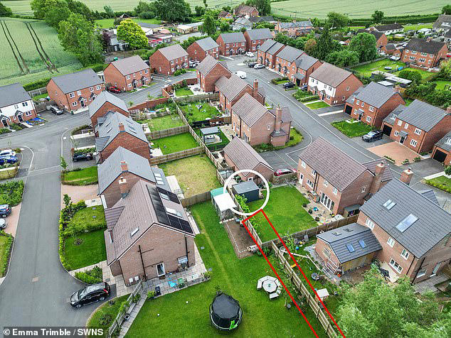 Father embroiled in land row with neighbours who built garden office ...