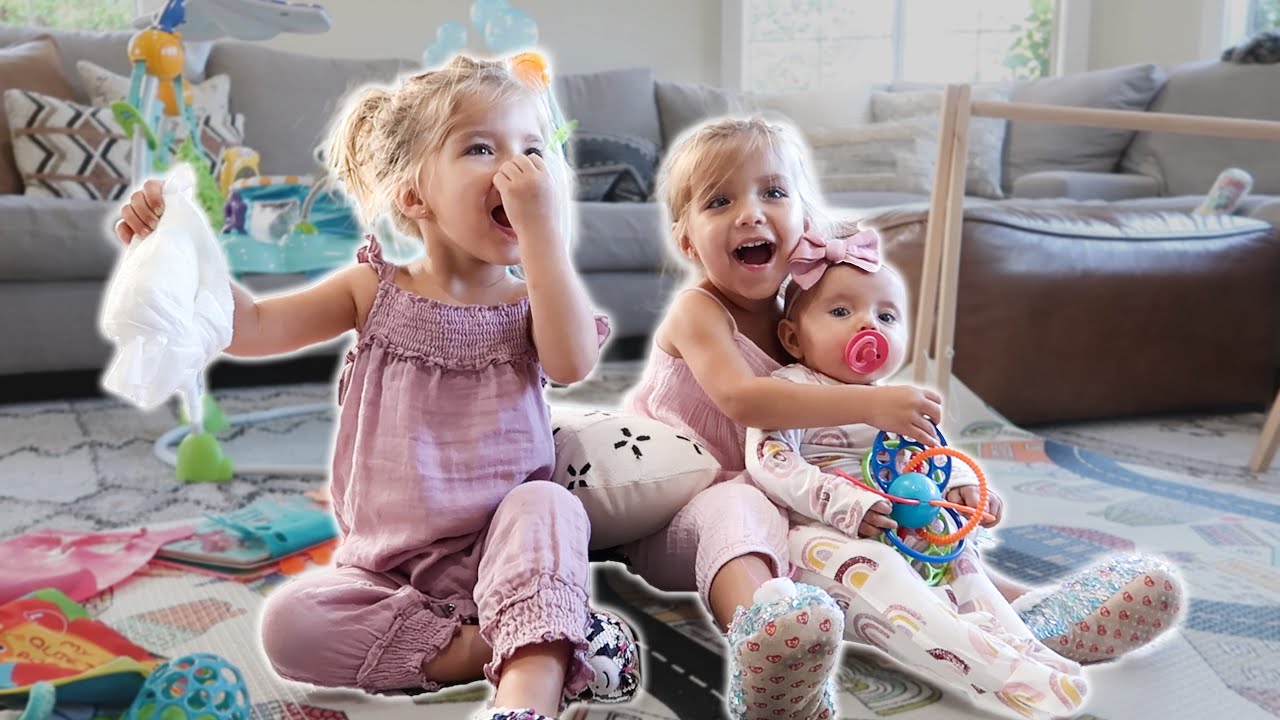 Watch set of older twins babysit their toddler sister during playtime