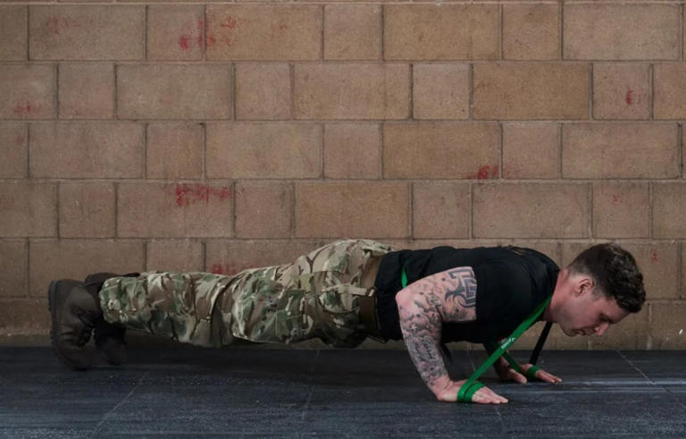 Prime yourself for working out with this full-body resistance band warm-up