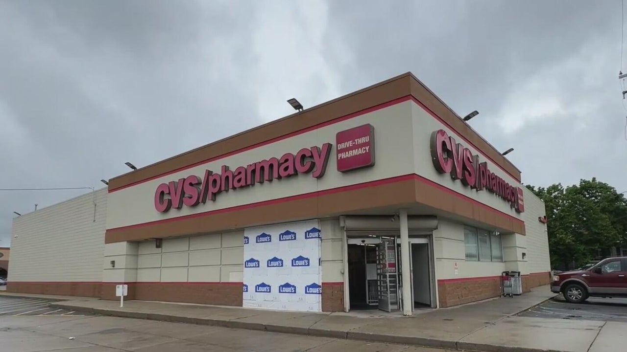Suspect rams front loader into drugstore building