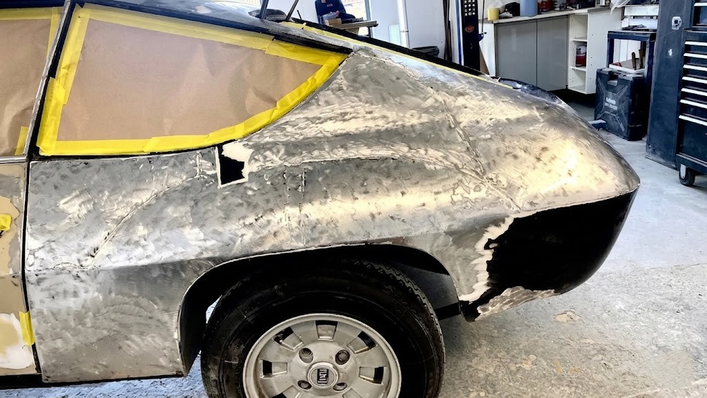 Lancia Fulvia Zagato paint stripping exposes major body repairs