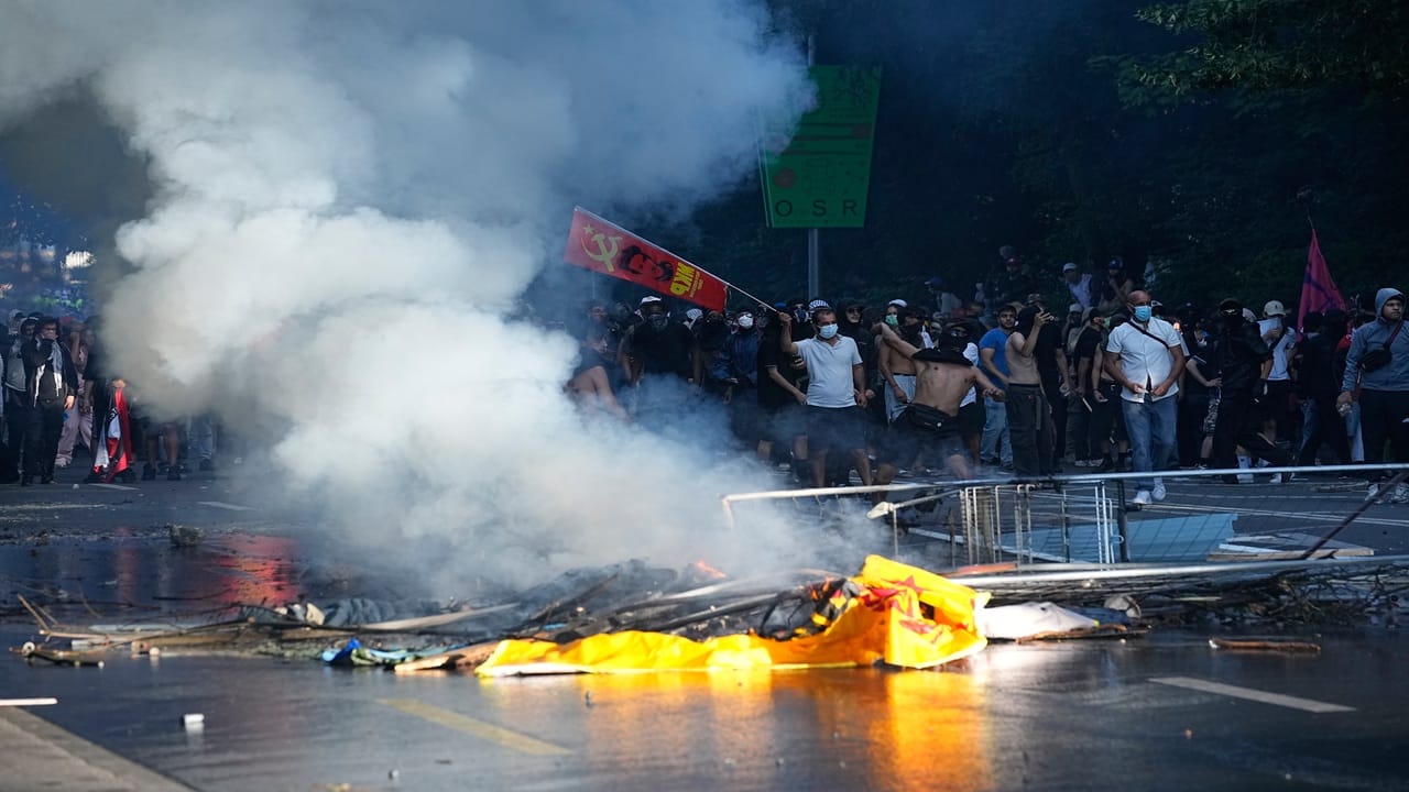 Anti-G7 protest turns violent in Geneva; Tesla torched, UN office ...
