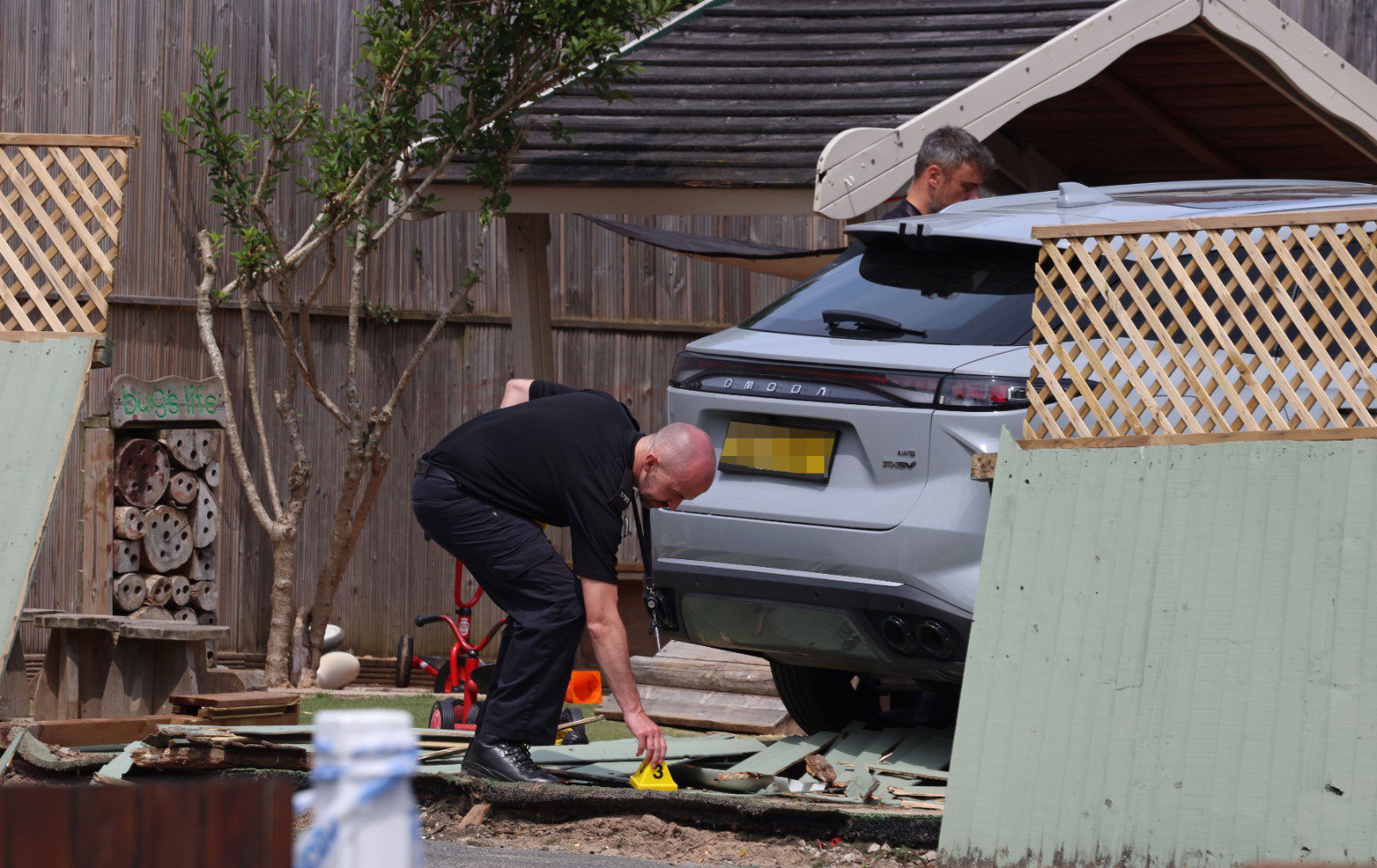 Three children injured after car crashes through fence into nursery ...