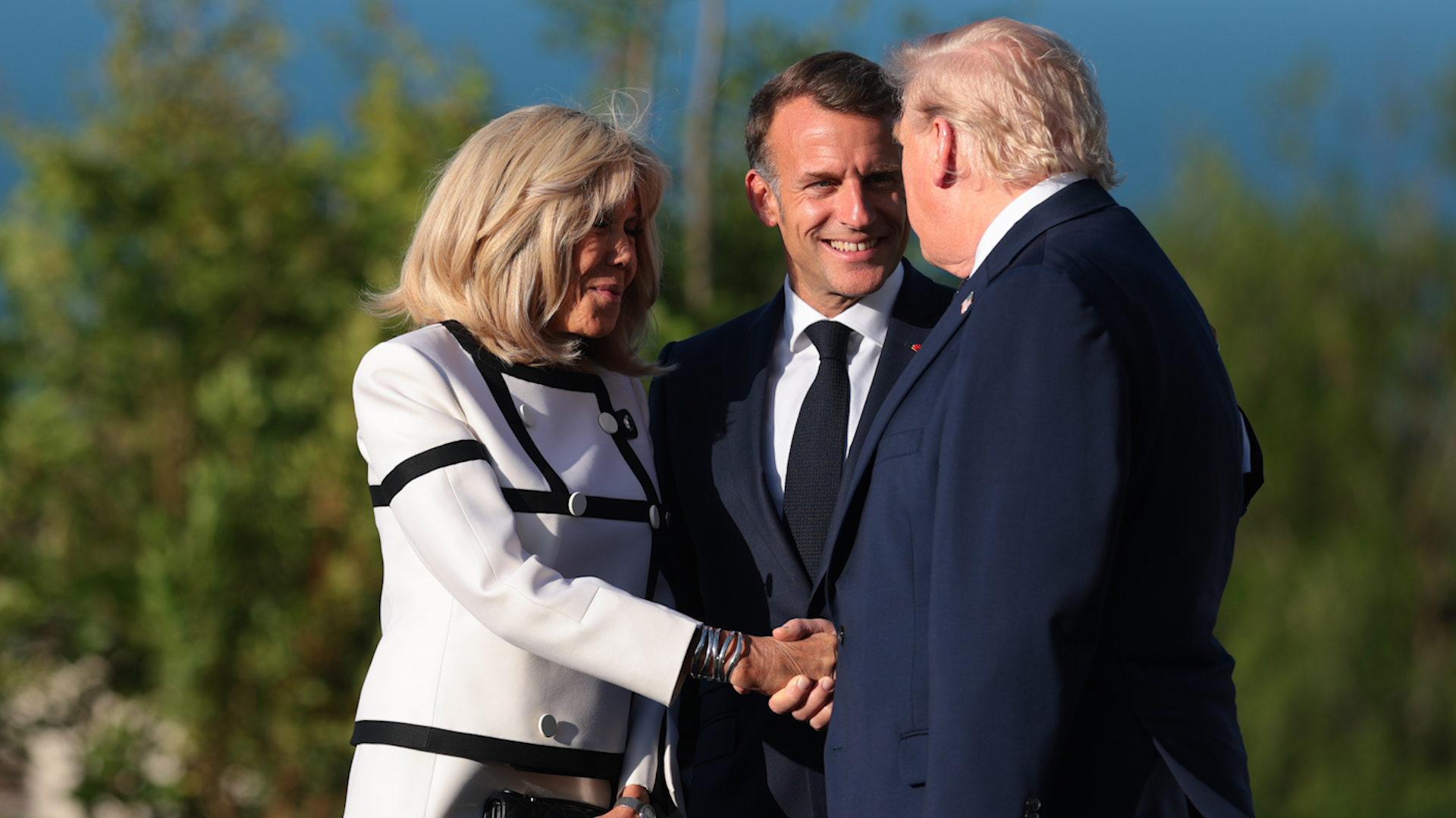 Trump gives Brigitte Macron long G7 handshake