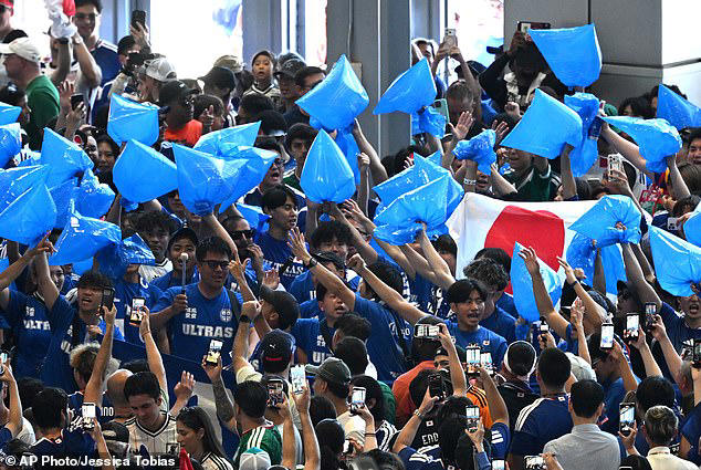 Is this why Japan fans are so tidy at World Cup? Tokyo's litter police ...
