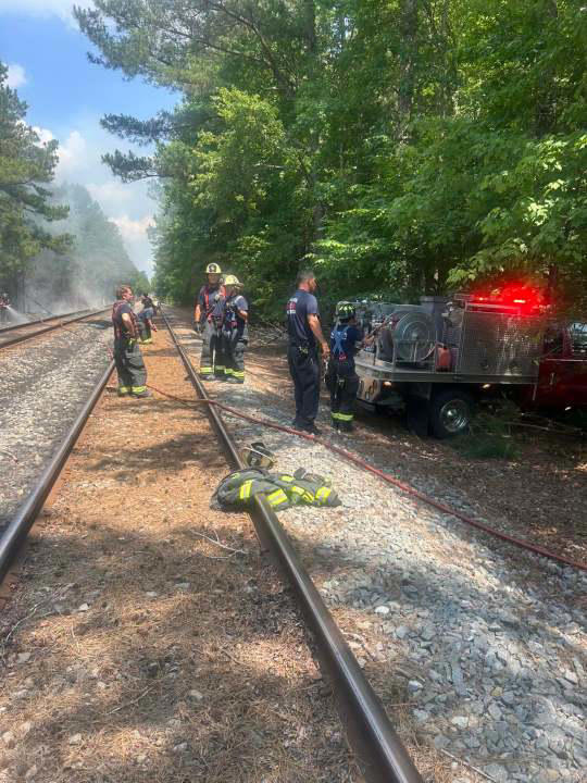 Fire crews battle spot fires along railroad tracks near Kenyon Road