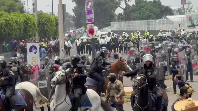Police clash with protesters in Mexico during World Cup match