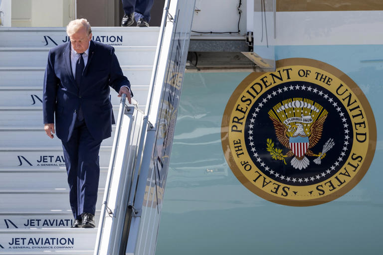Trump, 80, gingerly descends Air Force One stairs