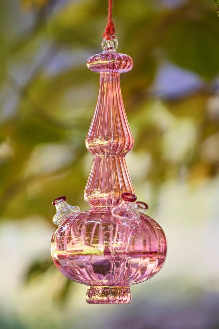 Anthropologie is selling blown-glass hummingbird feeders that'll ...
