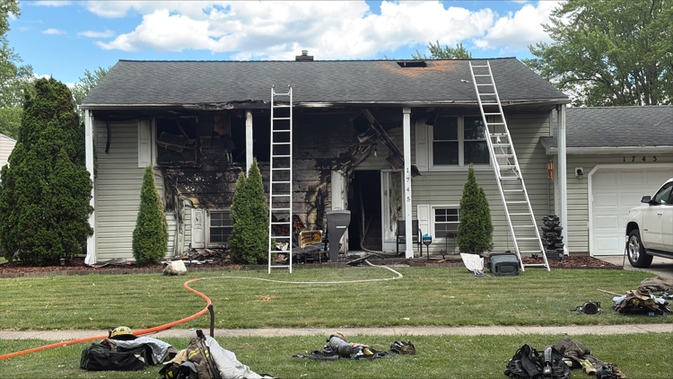 Person, dog uninjured in west Toledo house fire