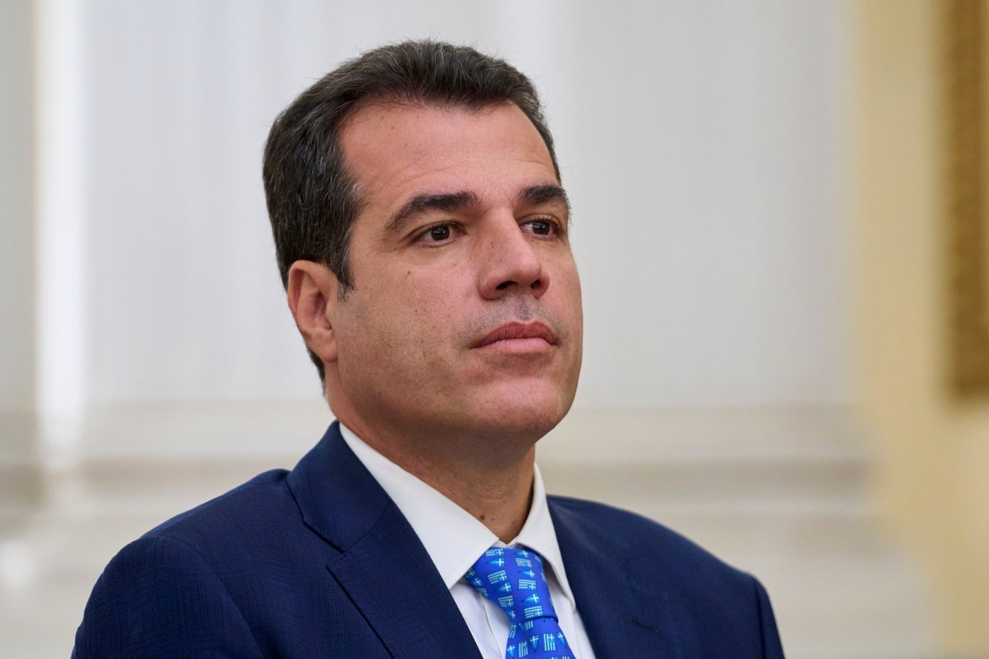 Greek minister calls criticism of tougher migration policies a 'badge ...