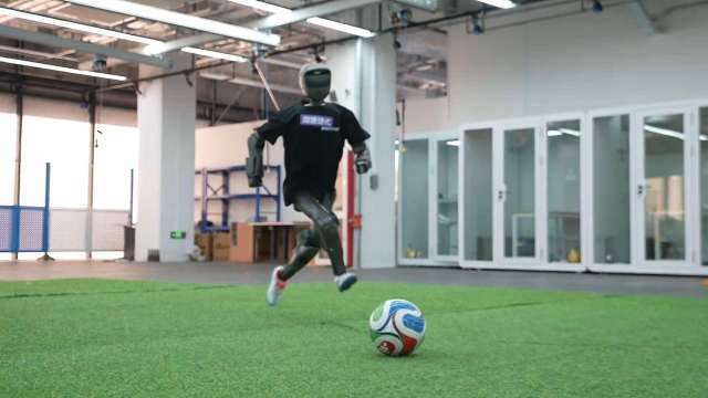 Tiny RoboCup star T1 kicks a soccer ball hard enough to smash a hole in ...