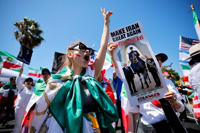 Iranian Americans wave protest flags as Iran play World Cup opener
