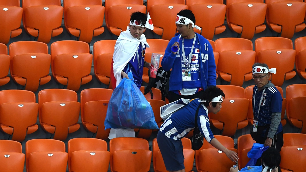 Japanese fans' stadium cleanup after draw wins global praise