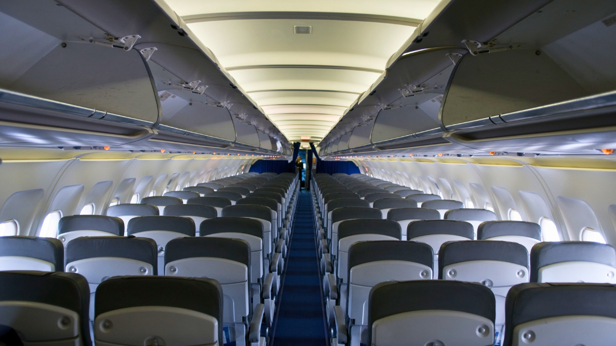 Why do commercial planes dim the cabin lights before takeoff and landing?