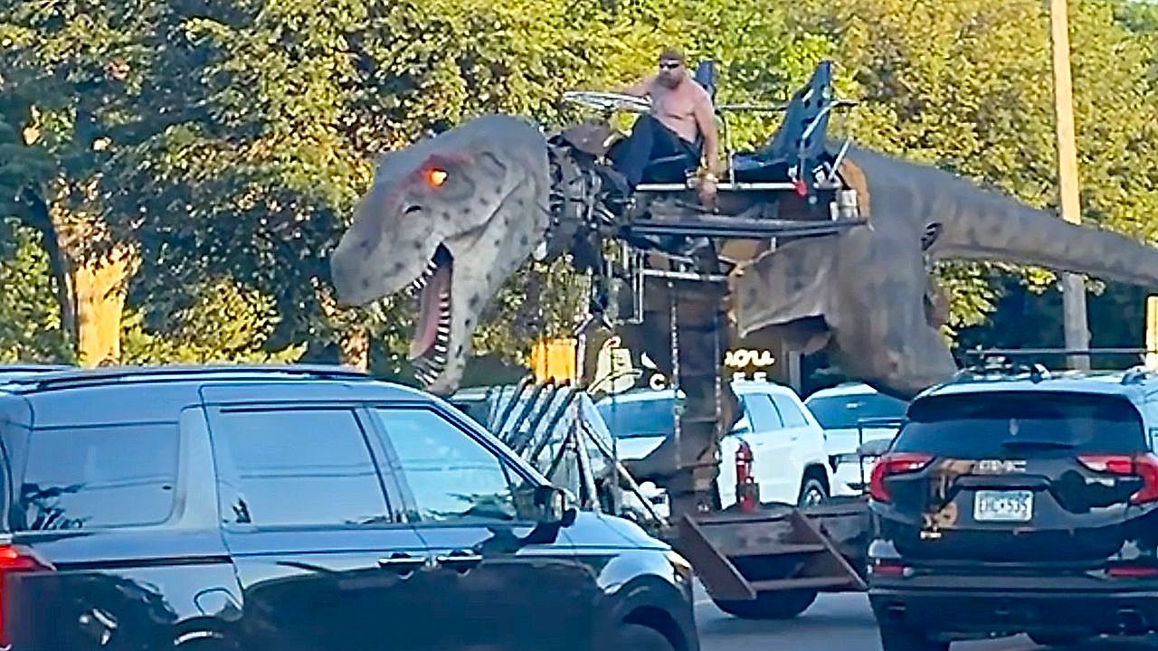 Giant T-Rex vehicle turns heads rolling through streets of Minneapolis