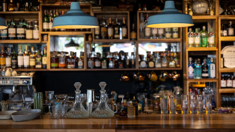 The practical reasons bars place mirrors behind their liquor selection