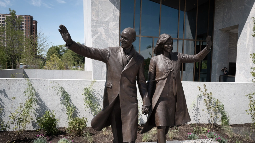 Obamas unveil first joint portrait ahead of center opening