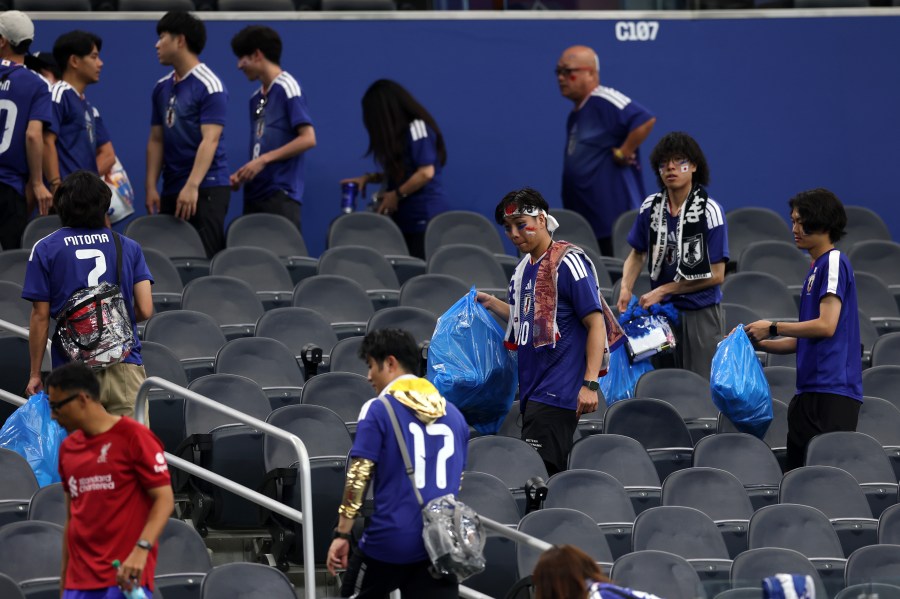 Why do Japan fans pick up trash after World Cup games?