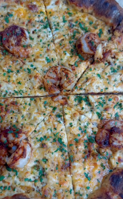 Seafood pizza with crawfish and sausage-stuffed flavor