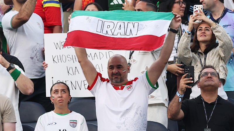 Flag spat on, anthem snubbed as Iran divides World Cup before epic draw