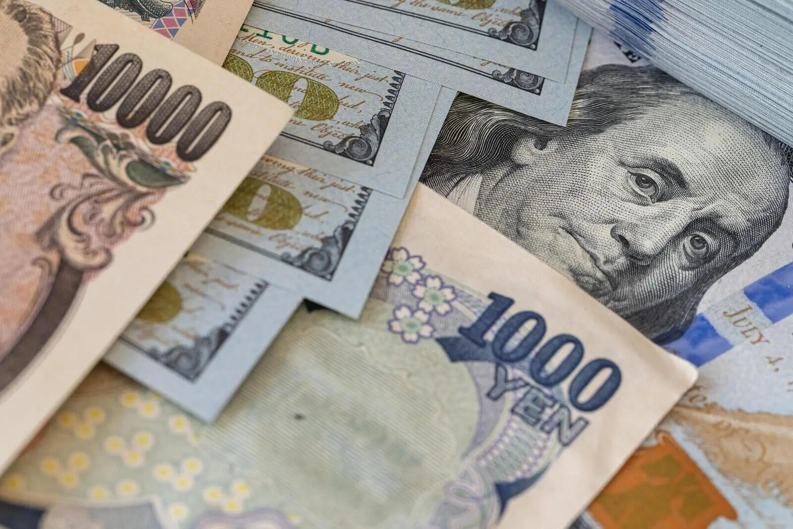 Dollar sways near 10-day lows as attention turns to BOJ and RBA