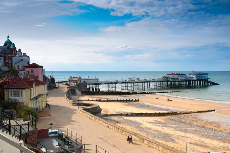 Unspoilt seaside town with sand beaches and picturesque pier that was ...