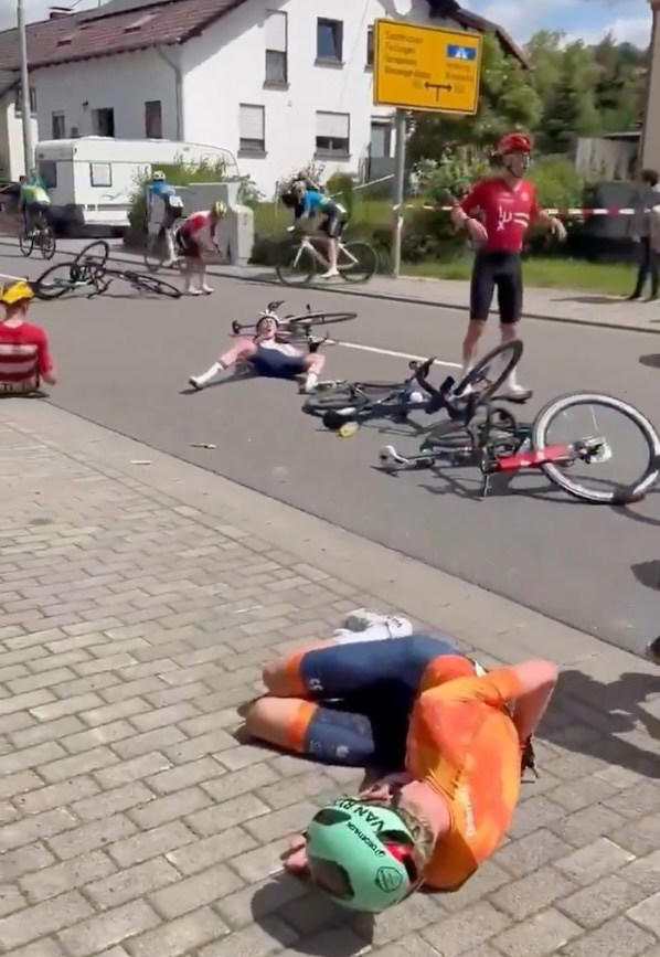 Elderly woman on mobility scooter drives into bike race, causing mass ...