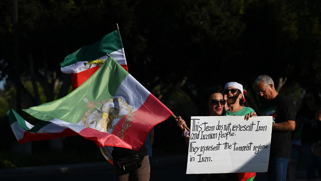 Iran fans defy FIFA flag ban at World Cup opener