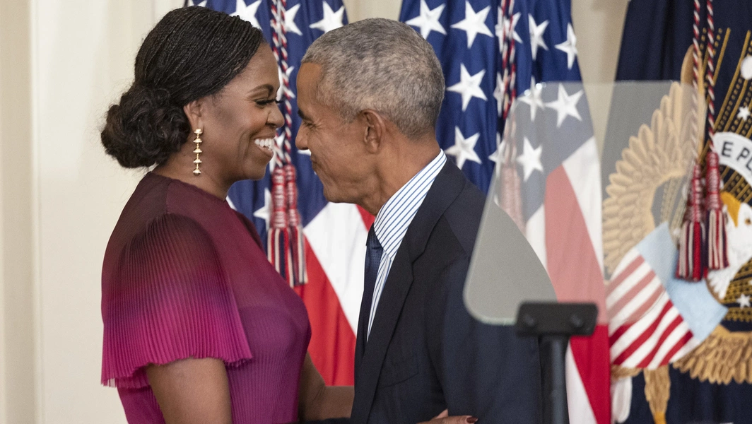 Obamas unveil first joint portrait ahead of center opening