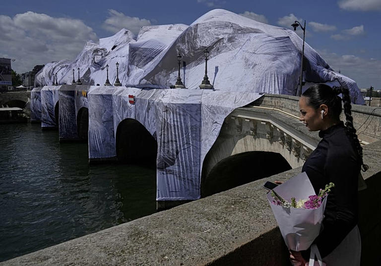 A cave for a crowd: French artist JR opens 'Caverne' art work on Pont ...