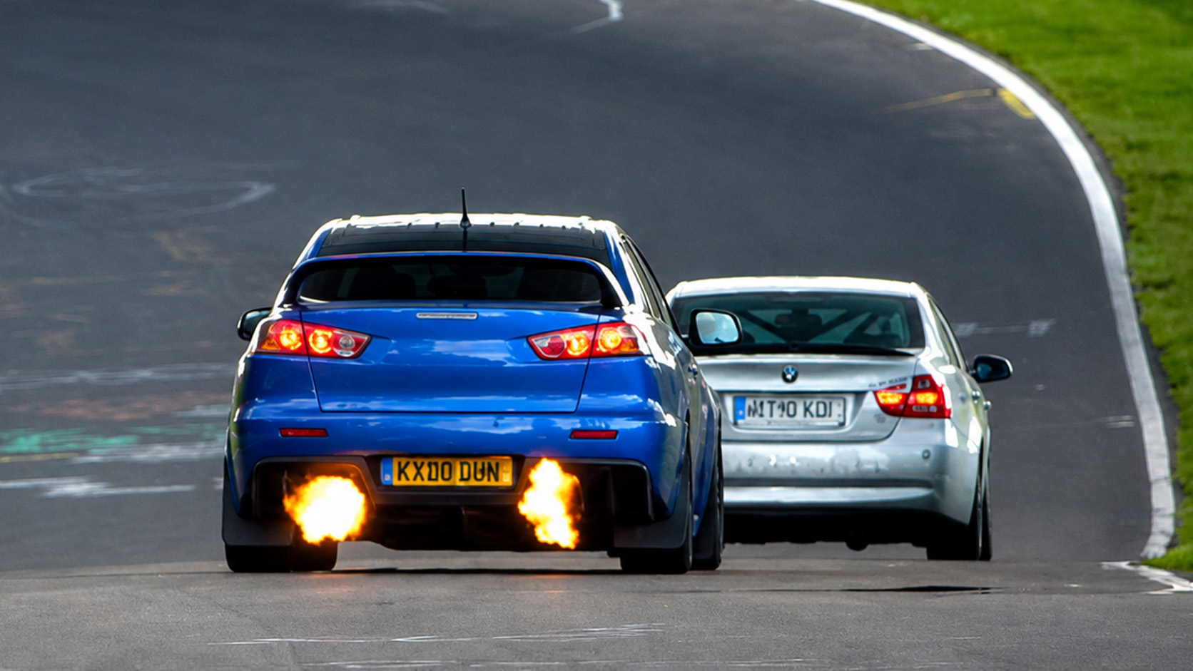 Mitsubishi Evo shoots flames during a high-speed Nürburgring track run