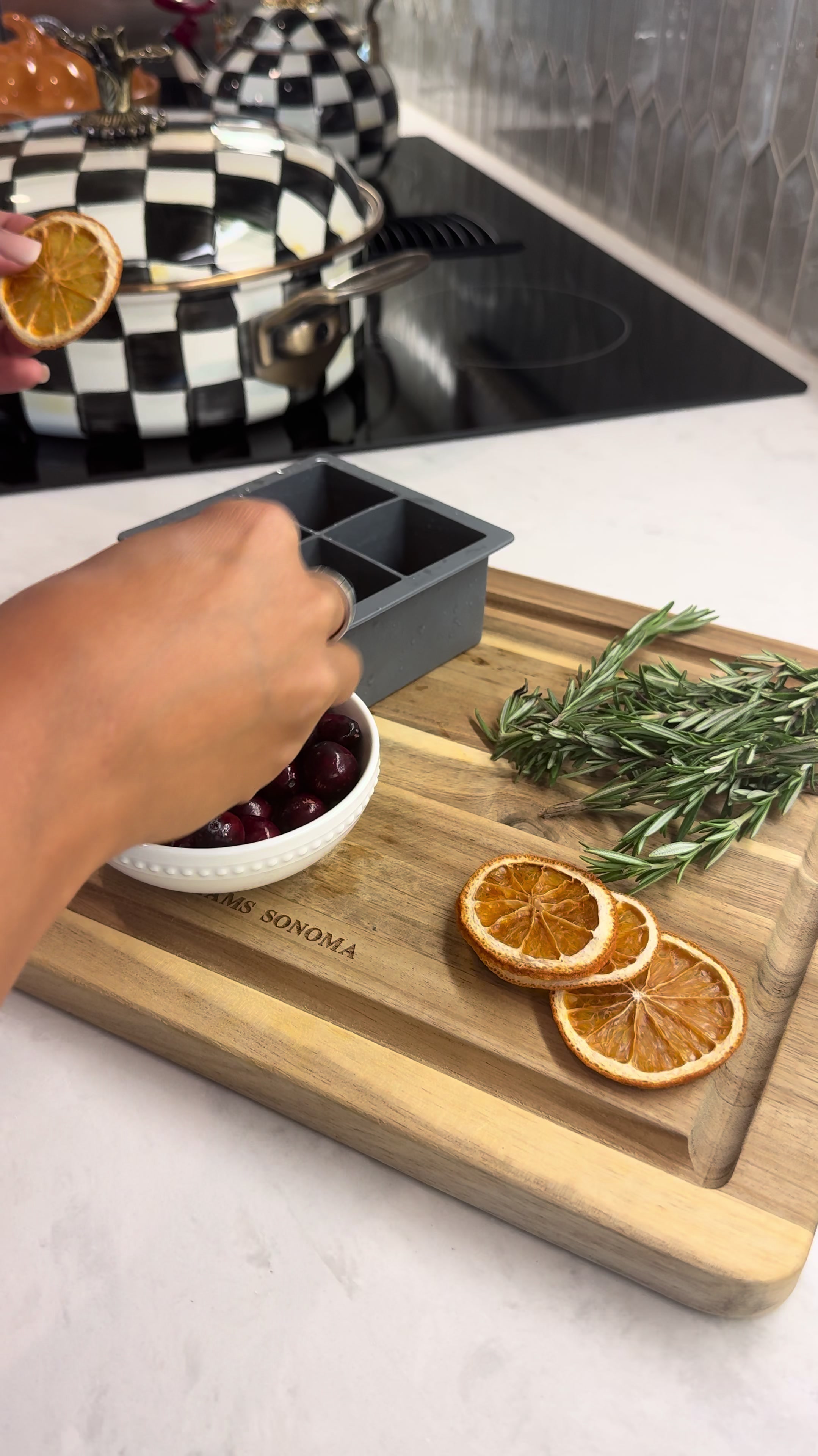 Making gourmet cocktail ice cubes with dried orange, rosemary, and ...