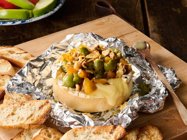 Ree Drummond's loaded campfire baked brie turns warm and melty over the ...