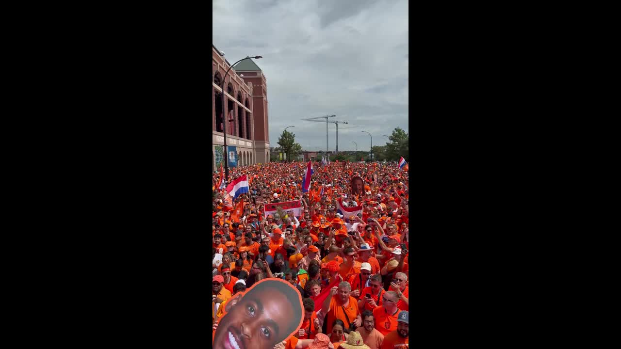 Netherlands fans bring orange wave as they arrive at World Cup