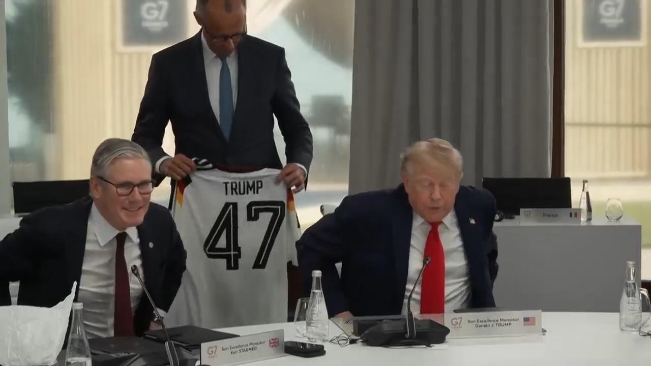 Germany's chancellor gives US president a soccer jersey with Trump’s ...