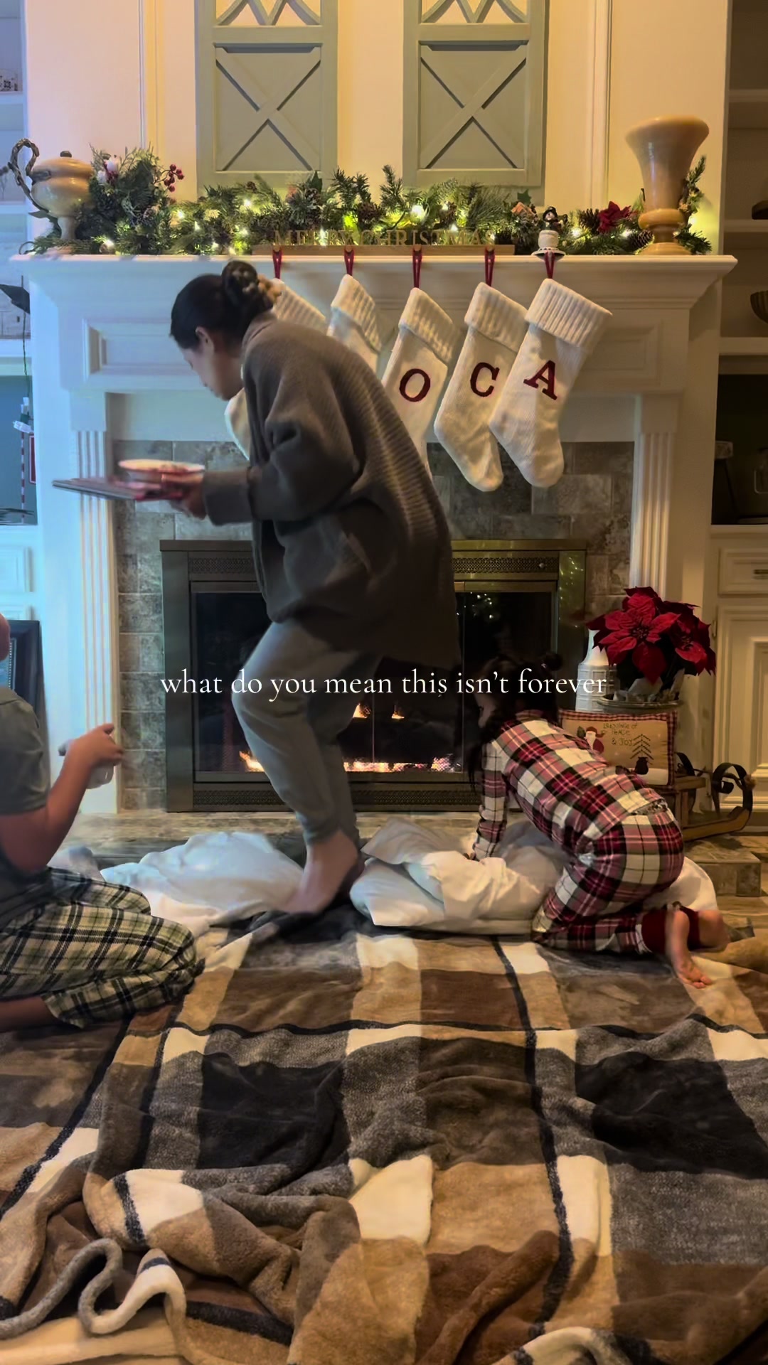A cozy Christmas family night with kids in pajamas and a blanket fort ...