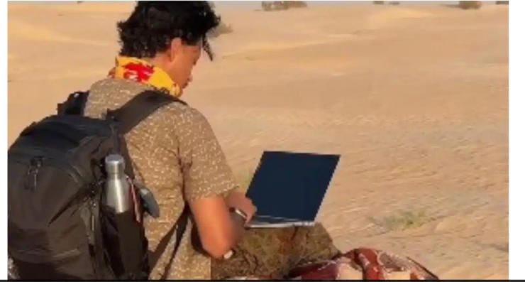 Man joins online meeting while riding camel in Sahara