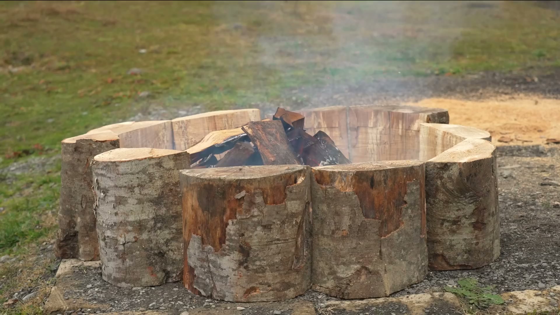 The art of cooking steaks between burning logs