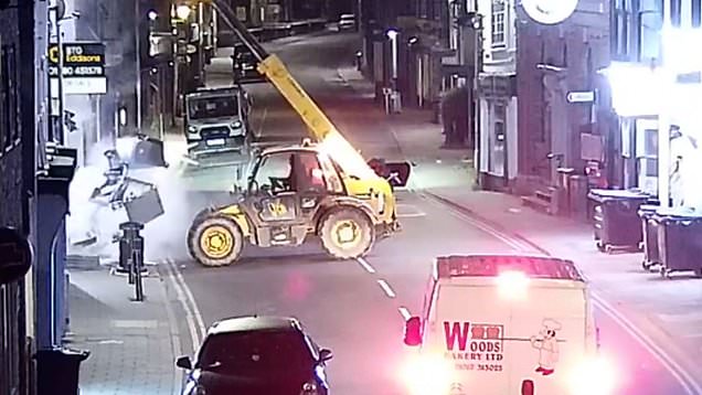 Moment stolen construction vehicle ram raids bank in the middle of the ...