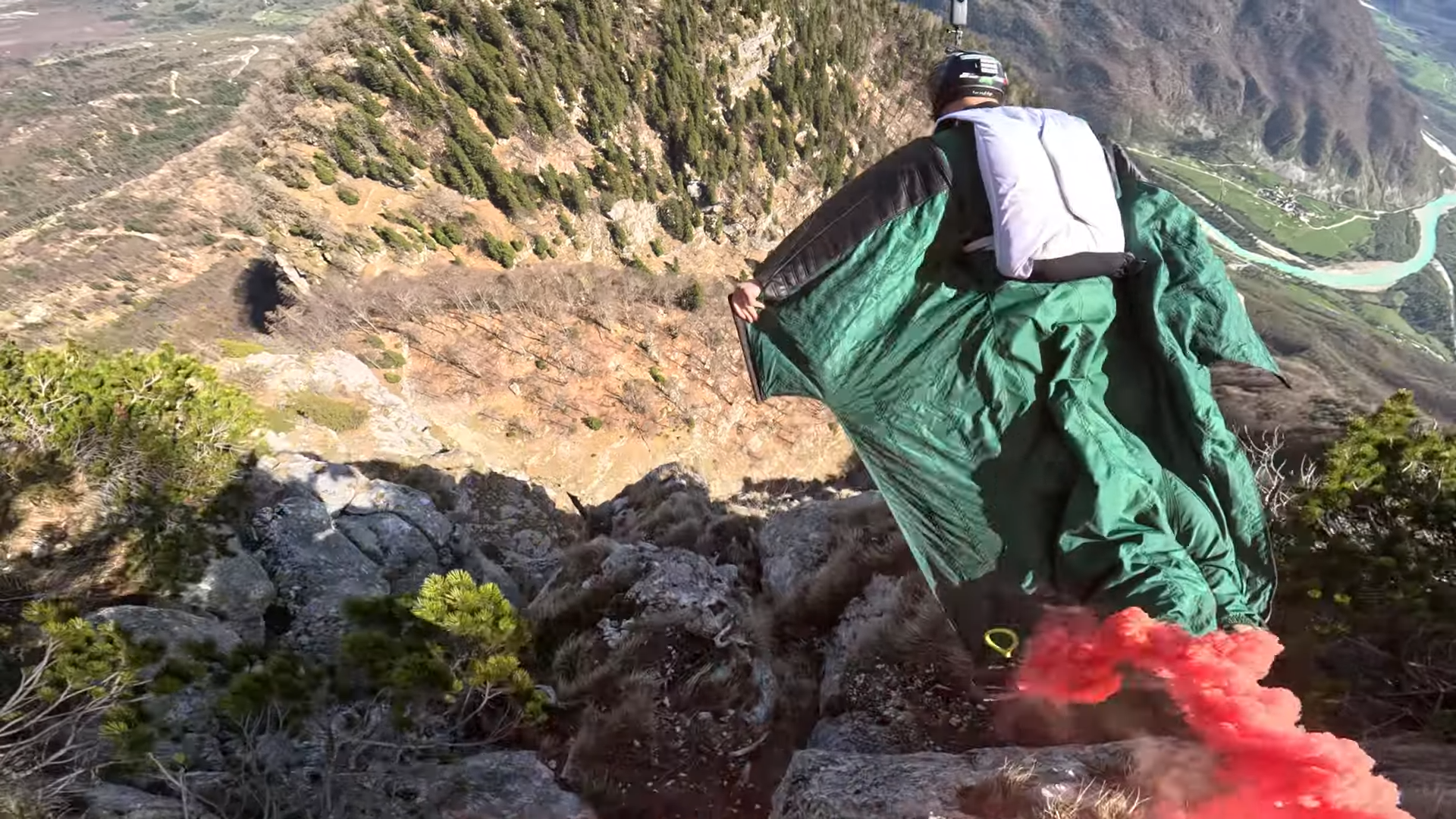 He jumped off a dangerous cliff - then red smoke appeared