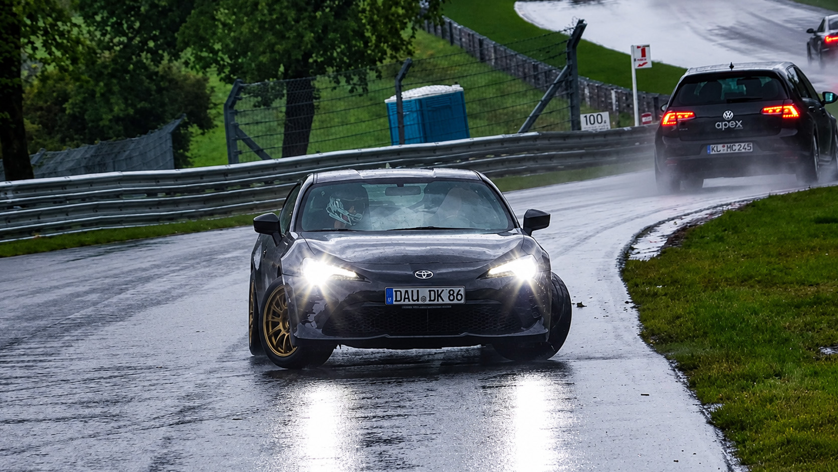 Toyota 86 driver spins out after losing grip on a wet track
